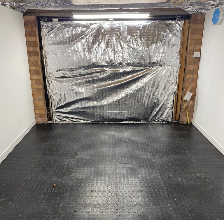 How to Insulate Roll-Up Door: Save Energy & Silence Noise